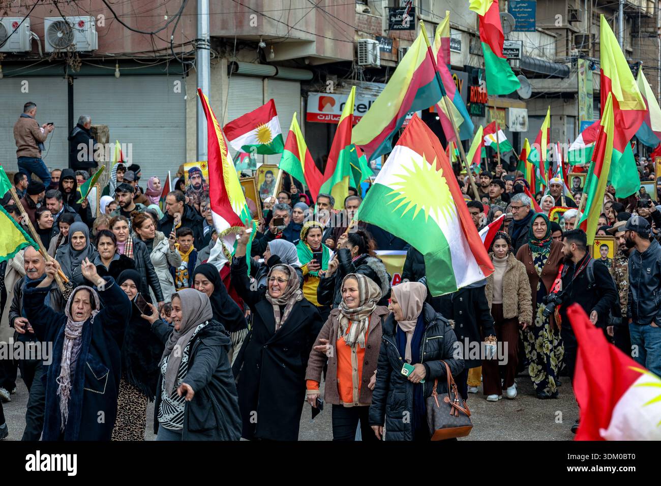 Kurdish demonstraters wave Kurdistan flags during a demonstration in ...