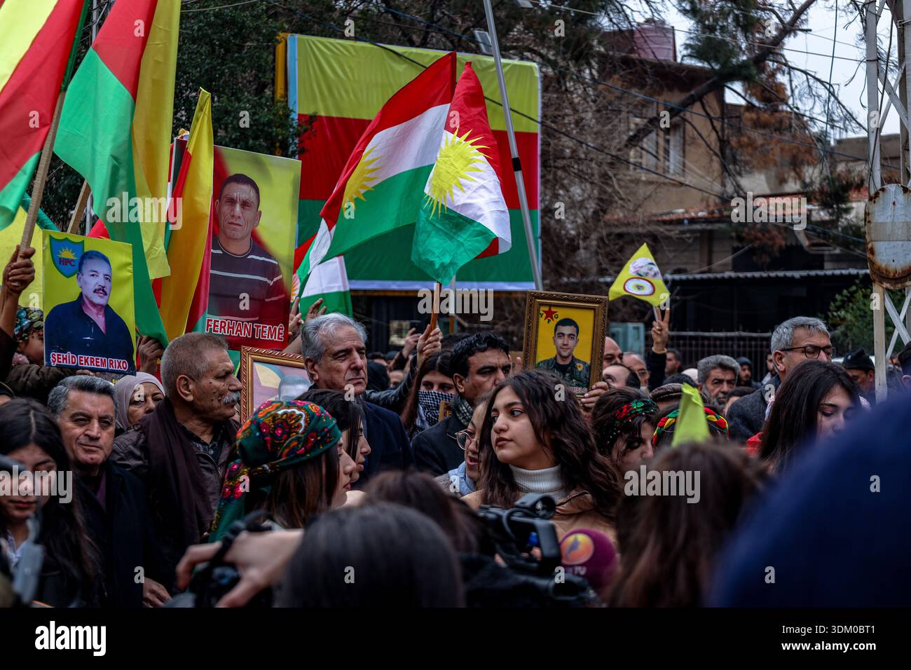Kurdish demonstraters gather and wave Kurdistan flags during a ...