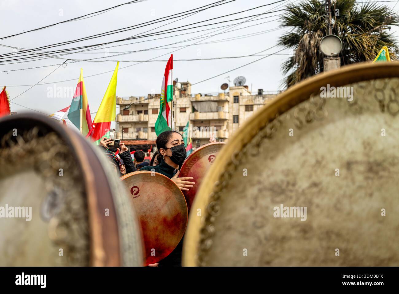 Kurdish demonstraters strike traditional "daf" hand drums during a ...
