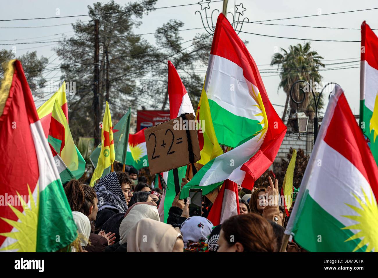 Kurdish demonstraters wave Kurdistan flags during a demonstration in ...
