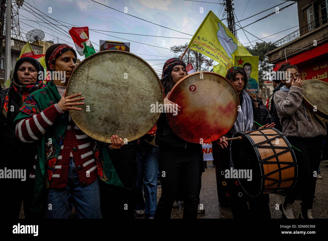 Women strike traditional "daf" hand drums as Kurdish demonstraters take ...