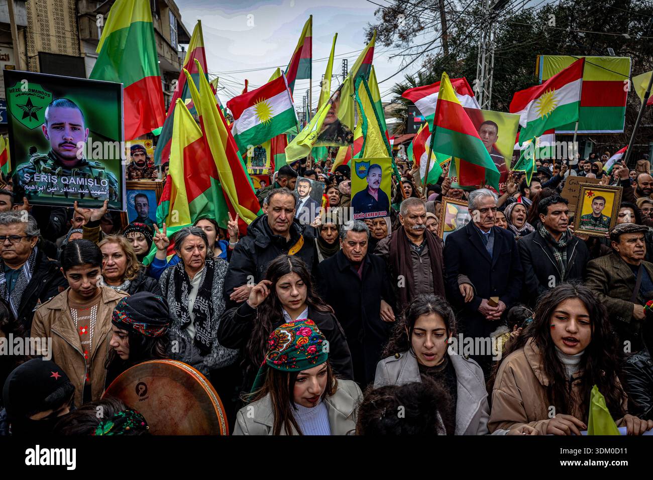 Kurdish demonstraters wave Kurdistan flags during a demonstration in ...