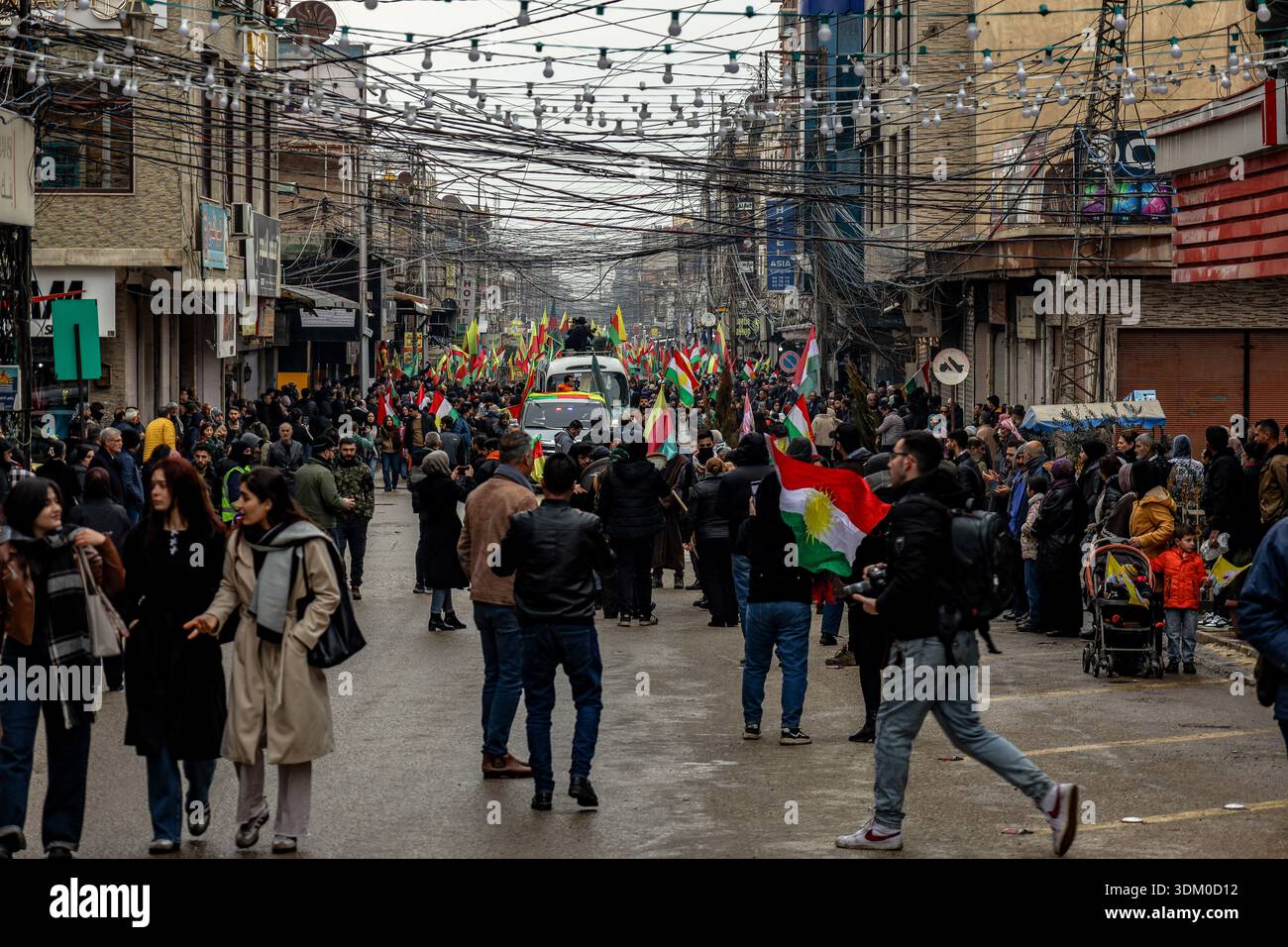 Kurdish demonstraters march while holding flags and placards during a ...