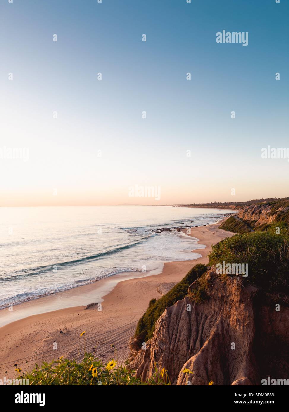 View of a sandy beach from cliff Stock Photo - Alamy