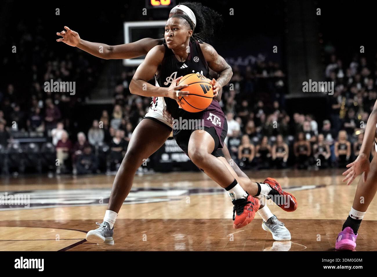 Texas A&M guard Ny'ceara Pryor, front, drives into the lane against ...
