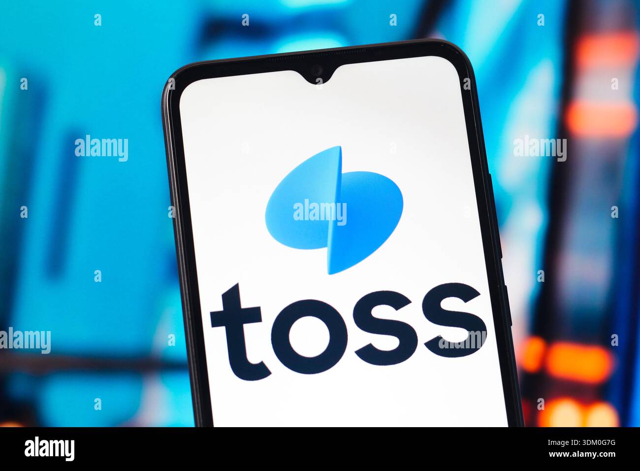 In this photo illustration, the Toss logo is seen displayed on a ...