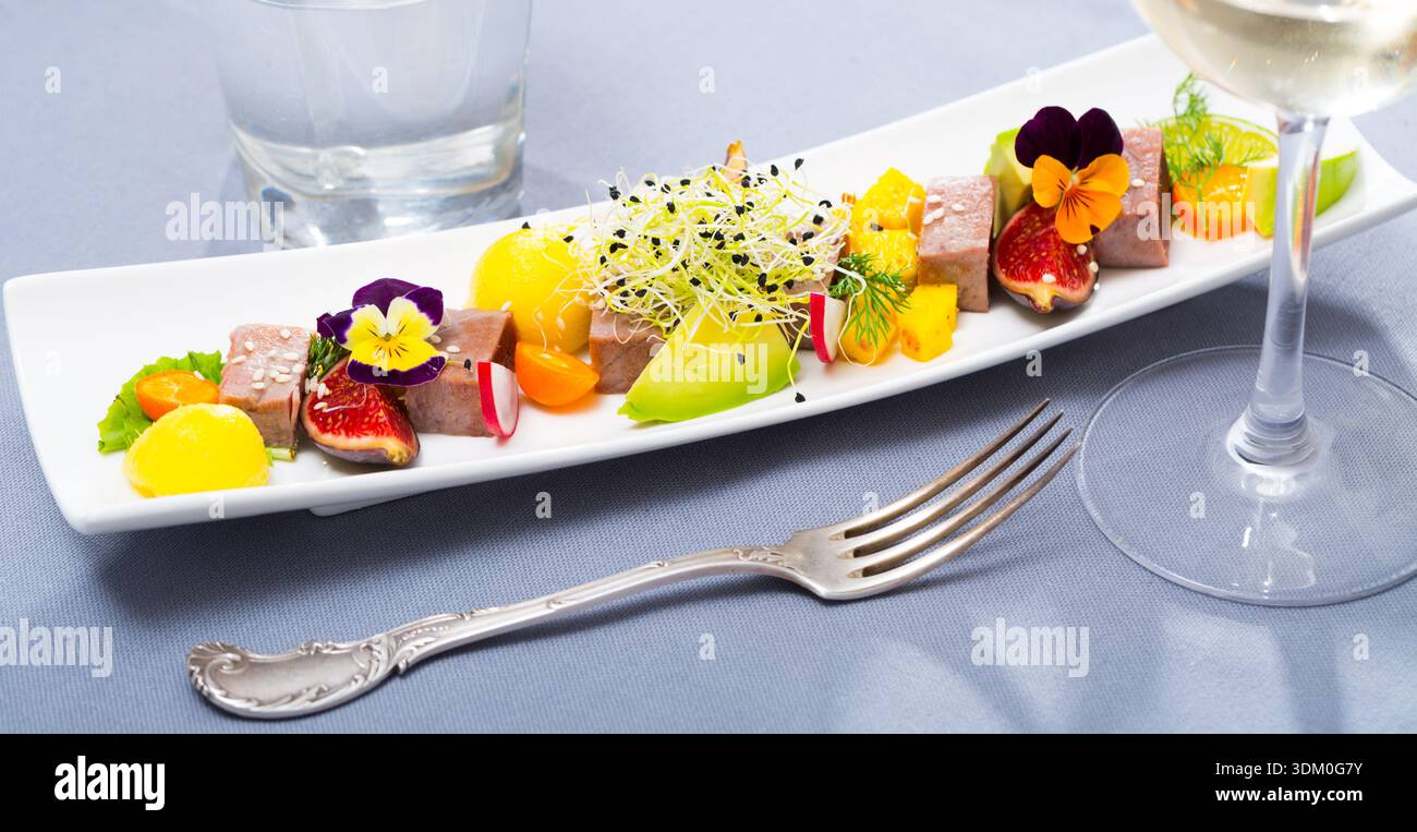 Tasty roasted tuna with mango and avocado Stock Photo - Alamy