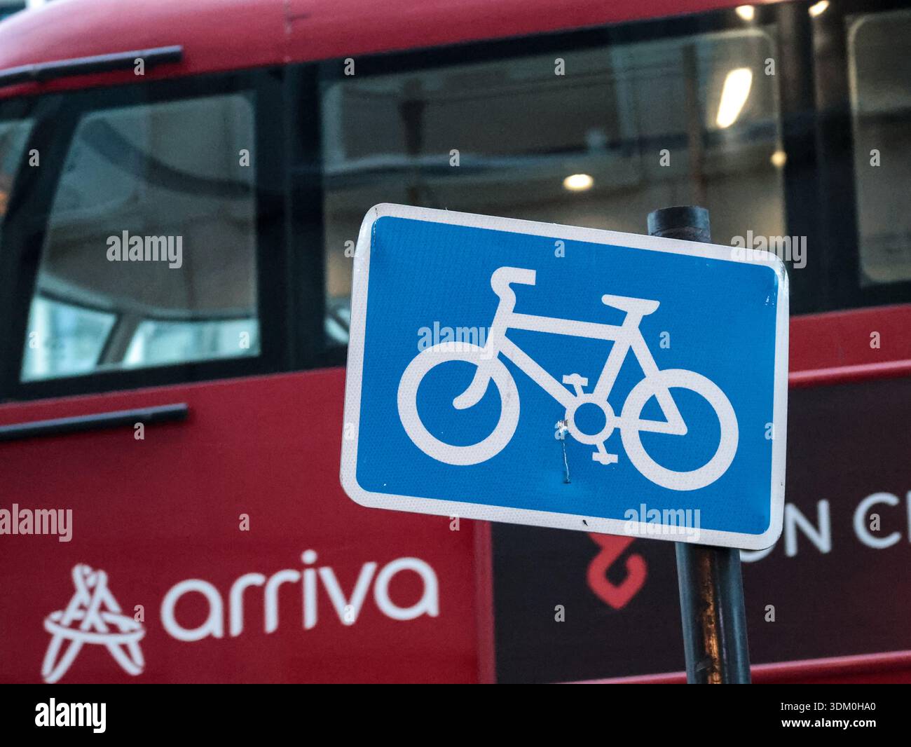A bicycle sign and Travel for London public bus are seen in the centre of London. (Photo by ...