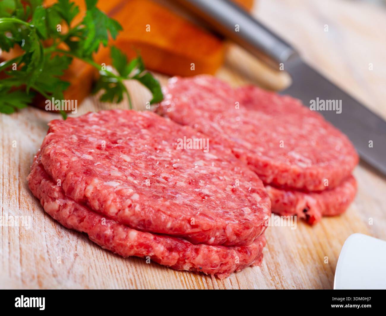 Patties from raw ground meat Stock Photo - Alamy
