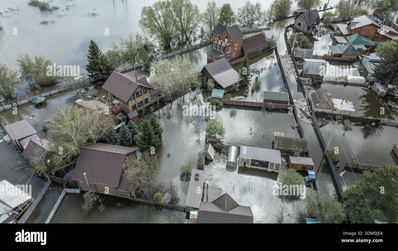 Aerial drone footage of a massive city flood with houses and streets ...