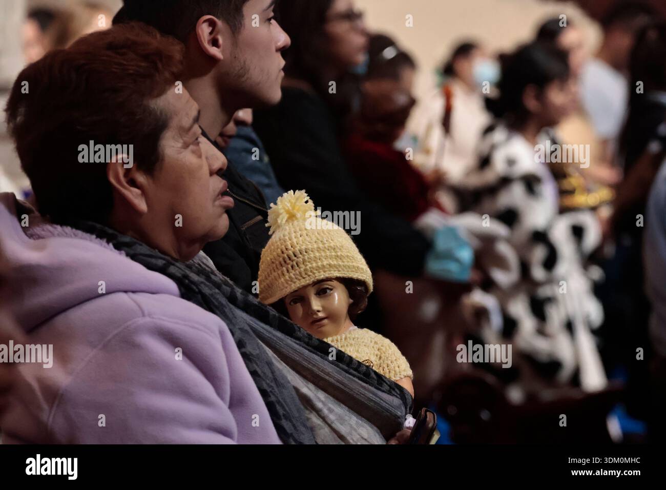 People holding Baby Jesus figurines during the Mass for Candlemas Day ...