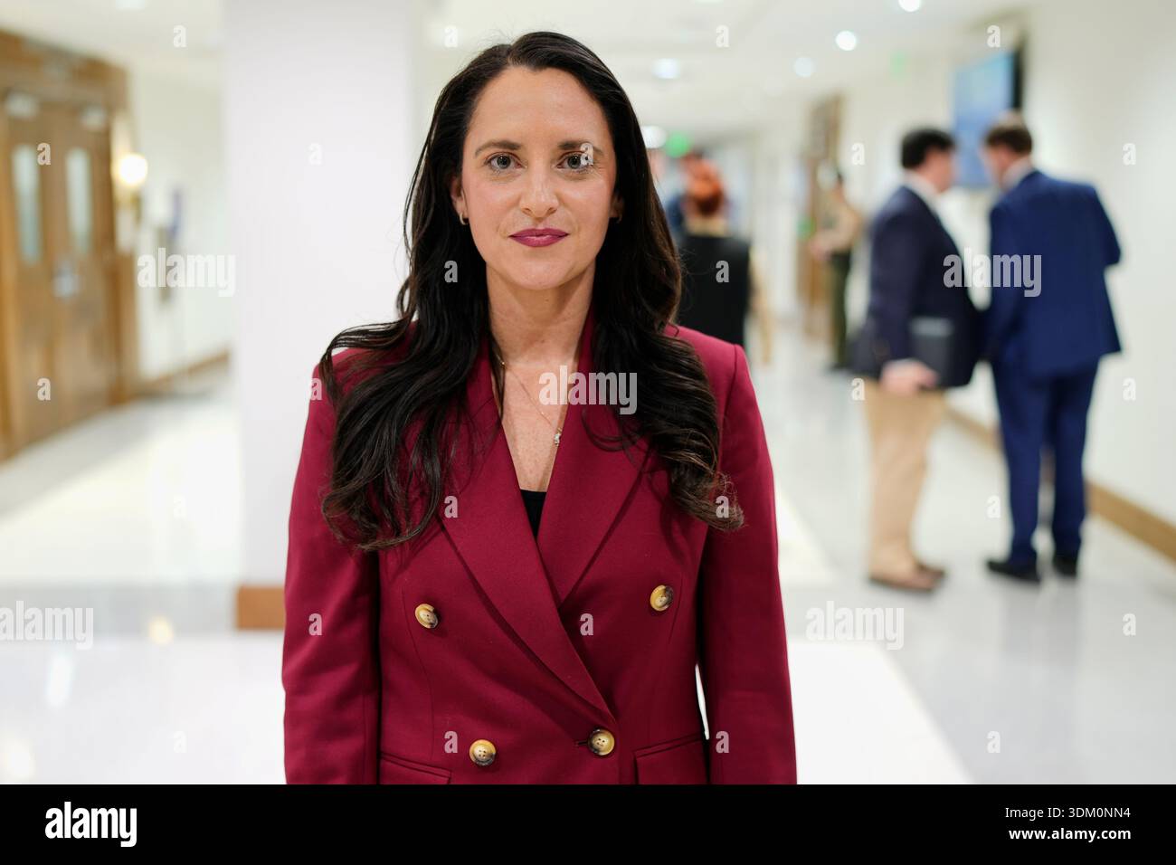 Molecular toxicologist Alexandra Muñoz poses outside a hearing room at ...