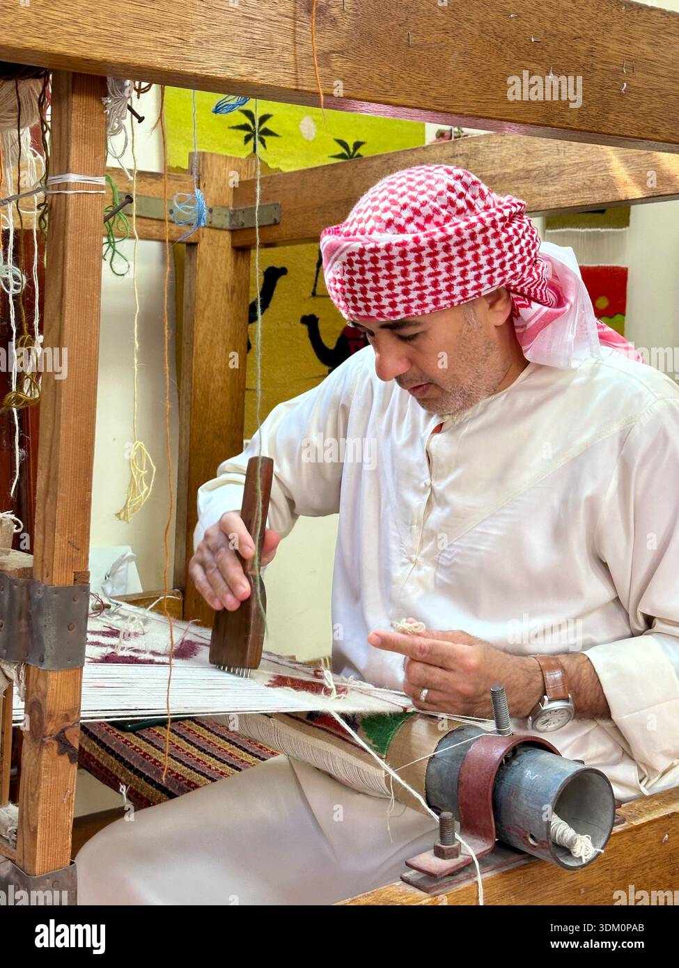 Traditional Emirati Carpet Weaver Stock Photo - Alamy