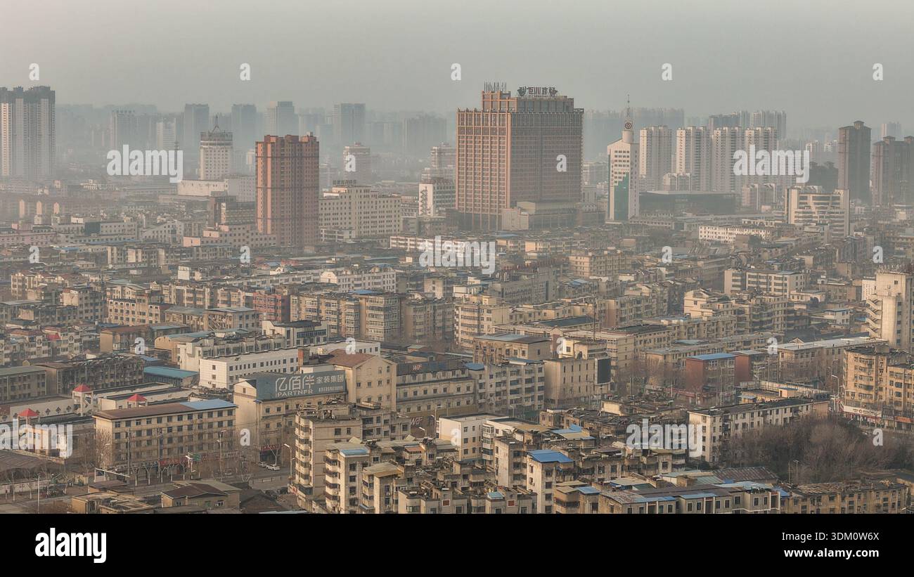 A dense, textured view of a historic urban core, with weathered low ...