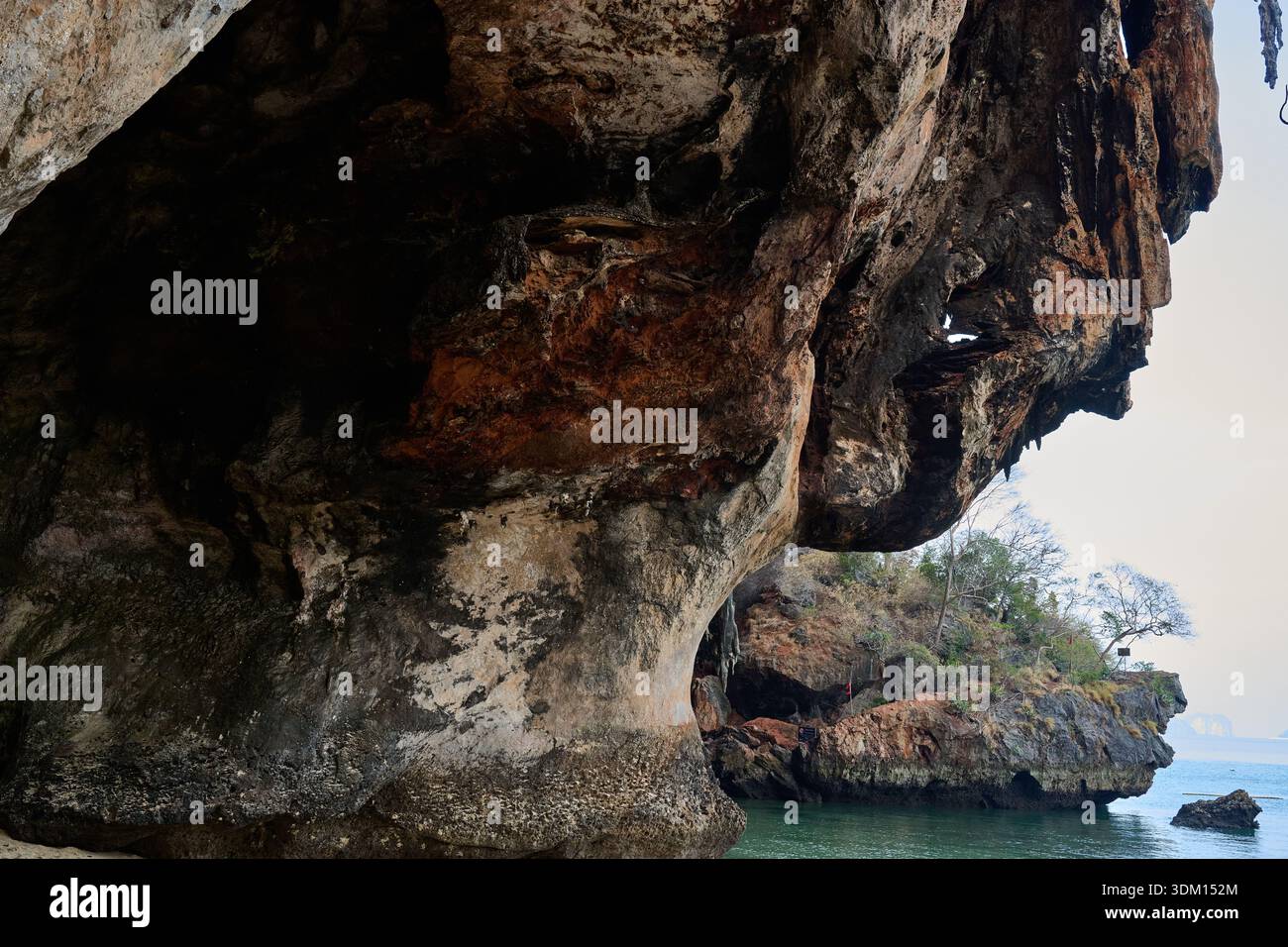 Limestone cliff overhang at the edge of the sea Stock Photo - Alamy