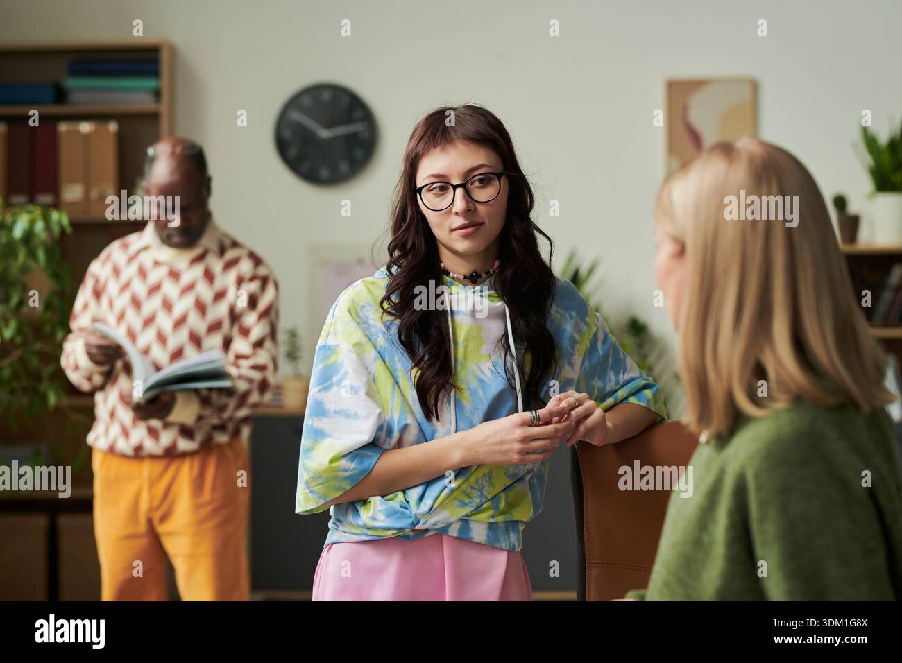 Young Woman Listening Attentively during Office Meeting Stock Photo - Alamy