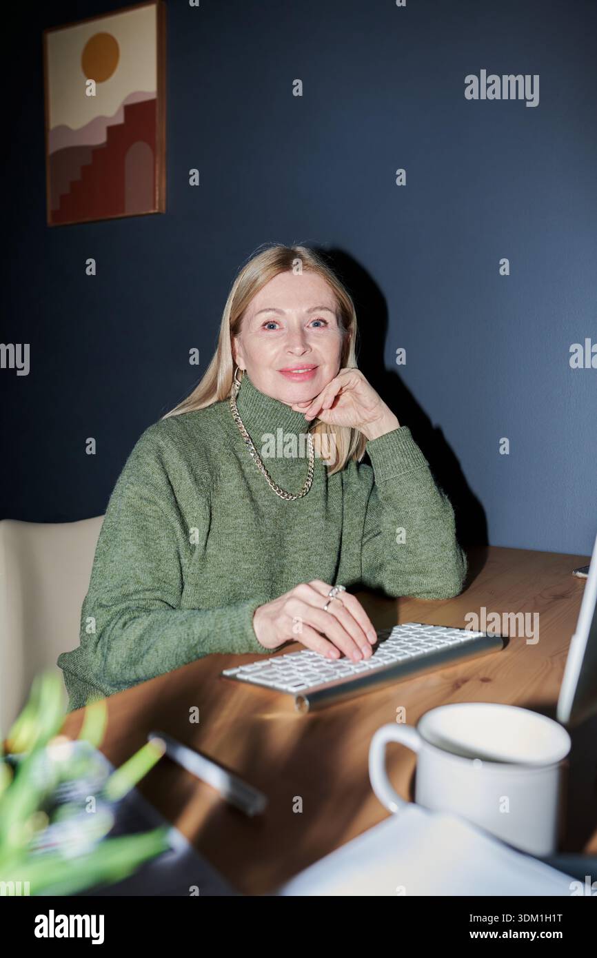 Portrait of Adult Woman Smiling While Using Computer Keyboard Stock ...