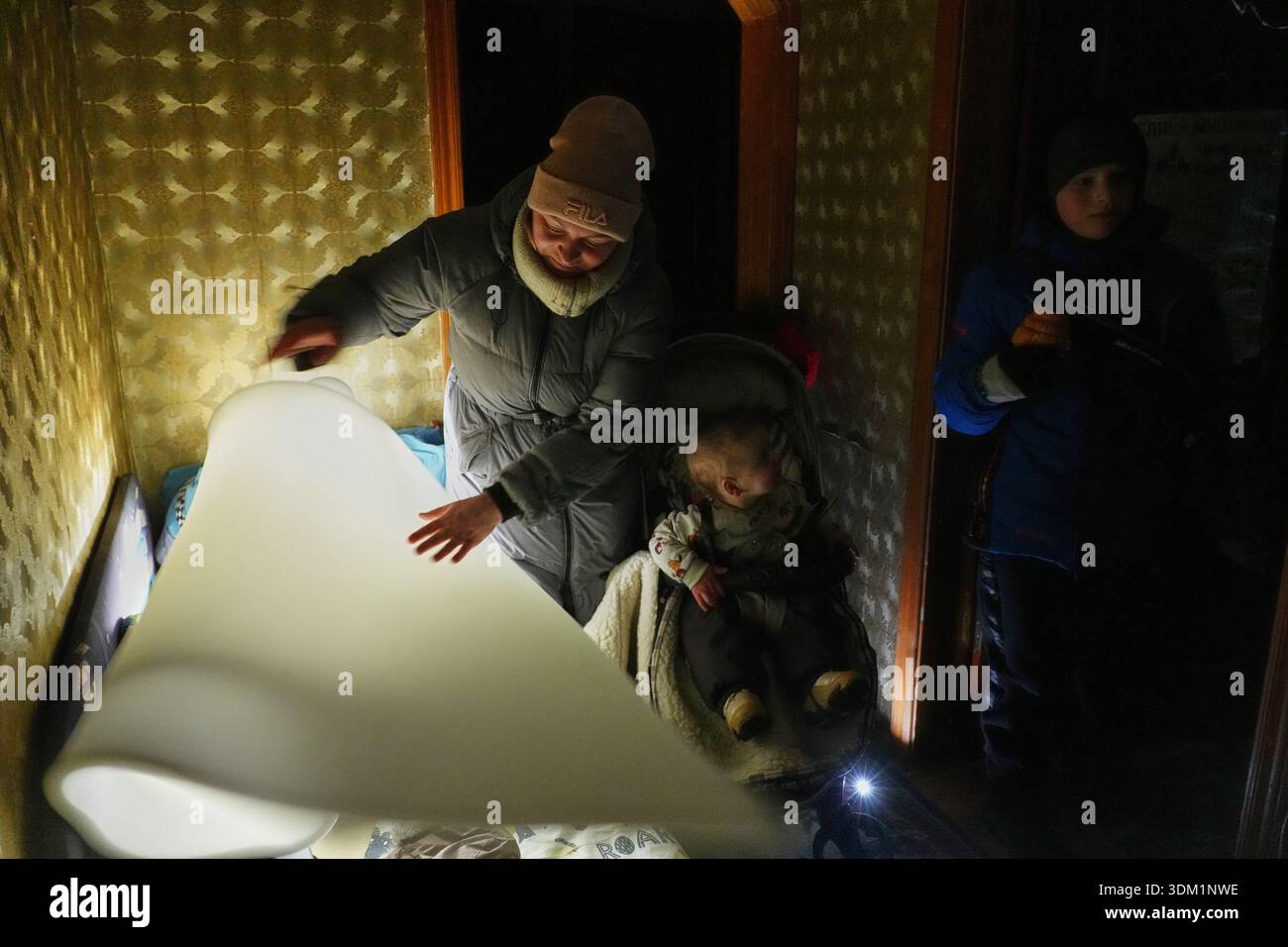 Yuliia Dolotova, 37, uses foam rubber to insulate her children’s bed in ...