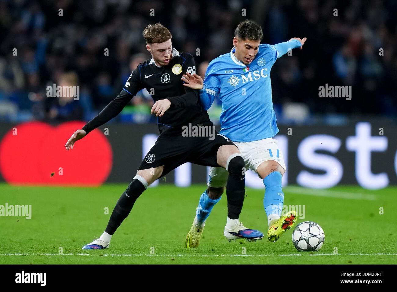 Cole Palmer of Chelsea FC and Mathias Olivera of SSC Napoli compete for ...