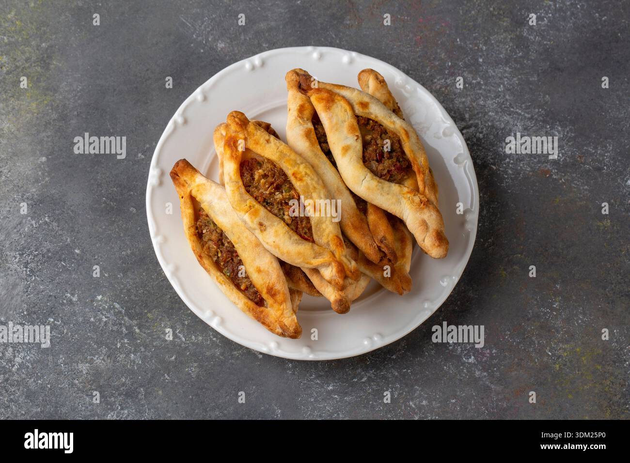 Dishes from traditional Turkish cuisine; Mini pita with minced meat ...
