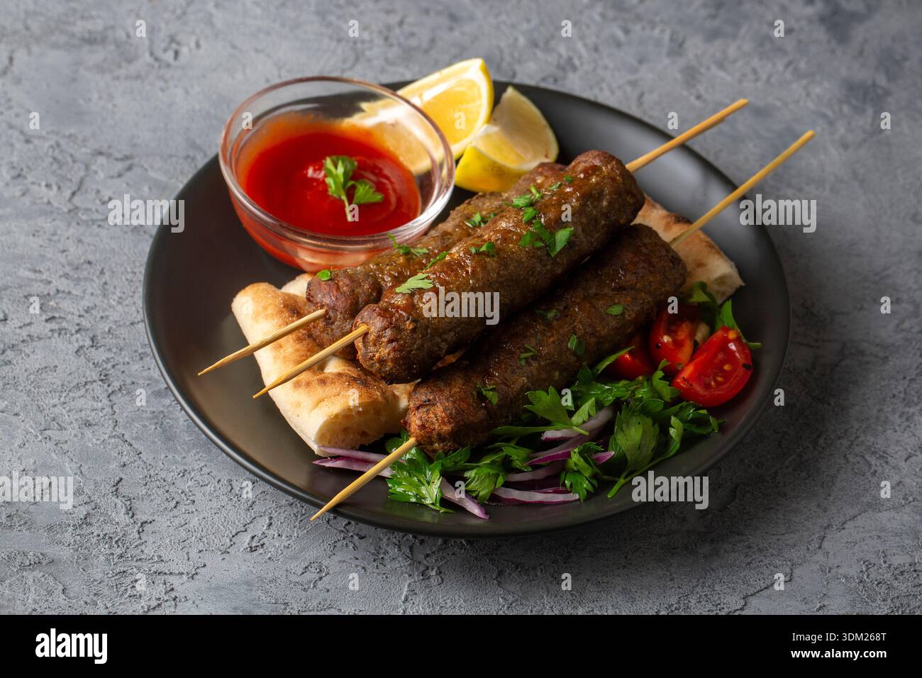 Homemade lula kebab with vegetables Stock Photo - Alamy