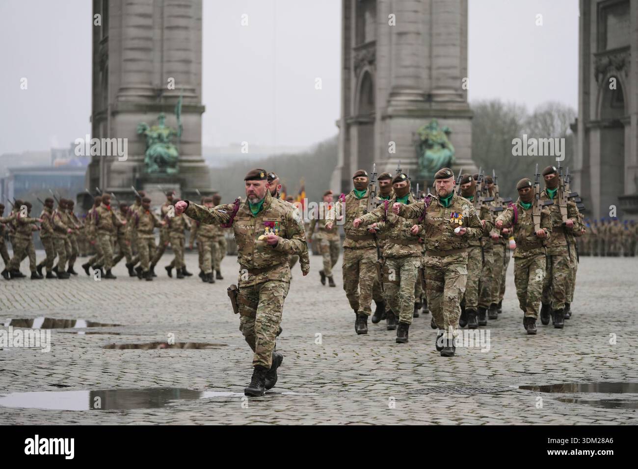 Belgian soldiers march in formation as they participate in a ceremony ...
