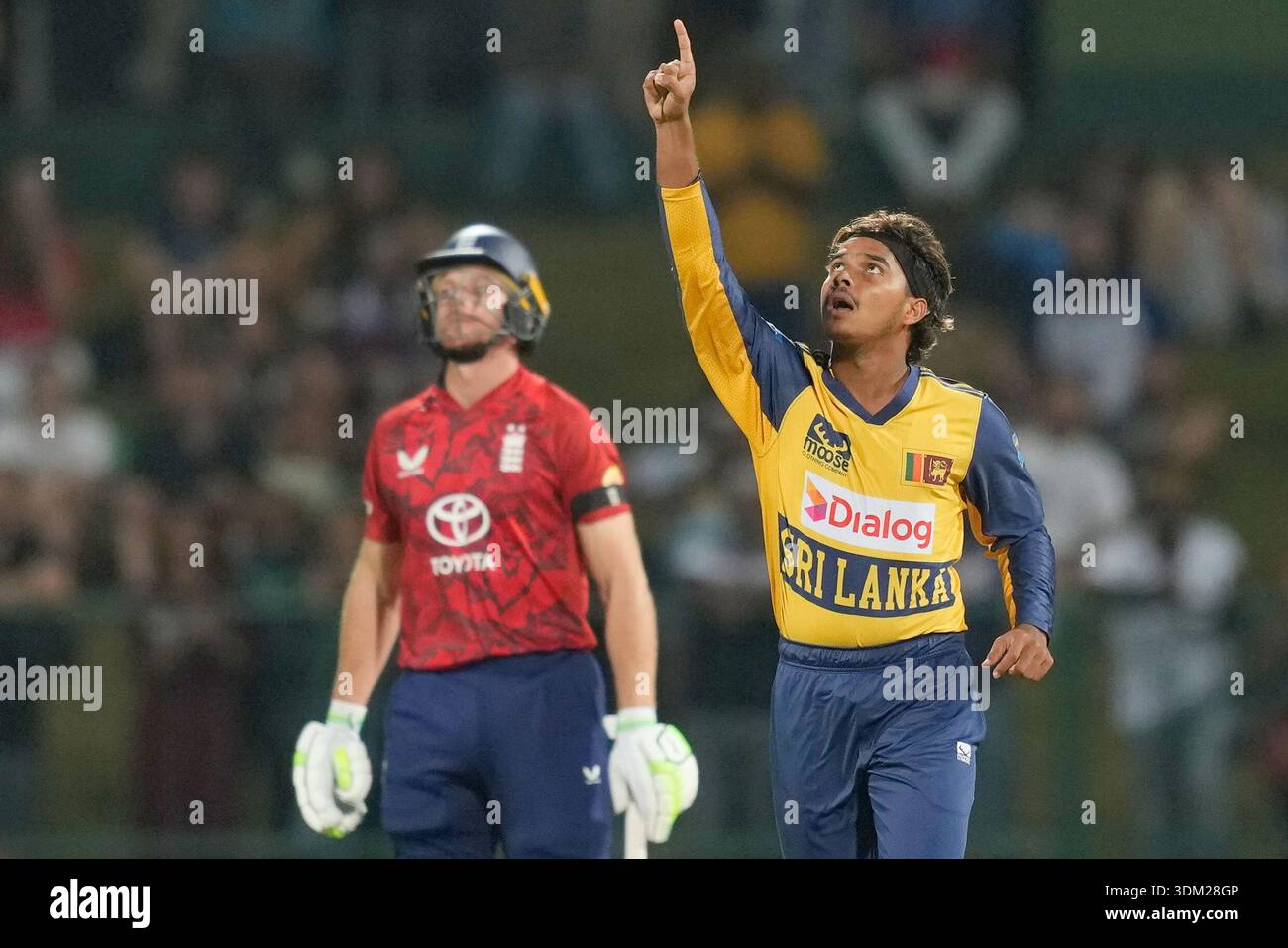 Sri Lanka's Dunith Wellalage, right, celebrates the wicket of England's ...