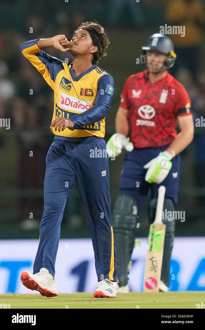 Sri Lanka's Dunith Wellalage, left, celebrates the wicket of England's ...