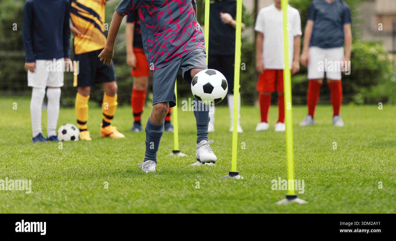 Youth Soccer Slalom Drill Training; Multiethnic Kids Practicing Ball ...