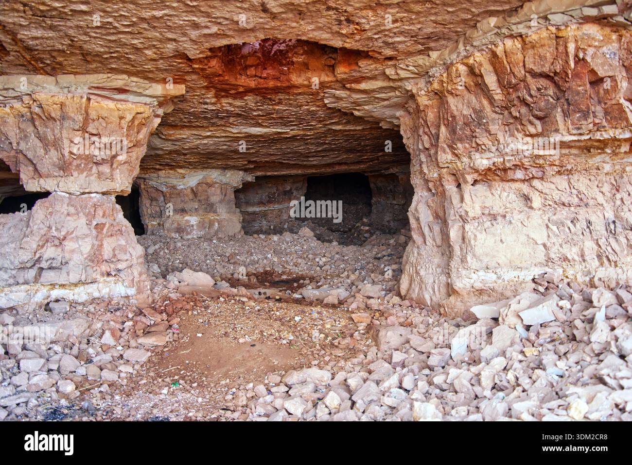 Ancient mining tunnels formed by excavation, showing a series of dark ...