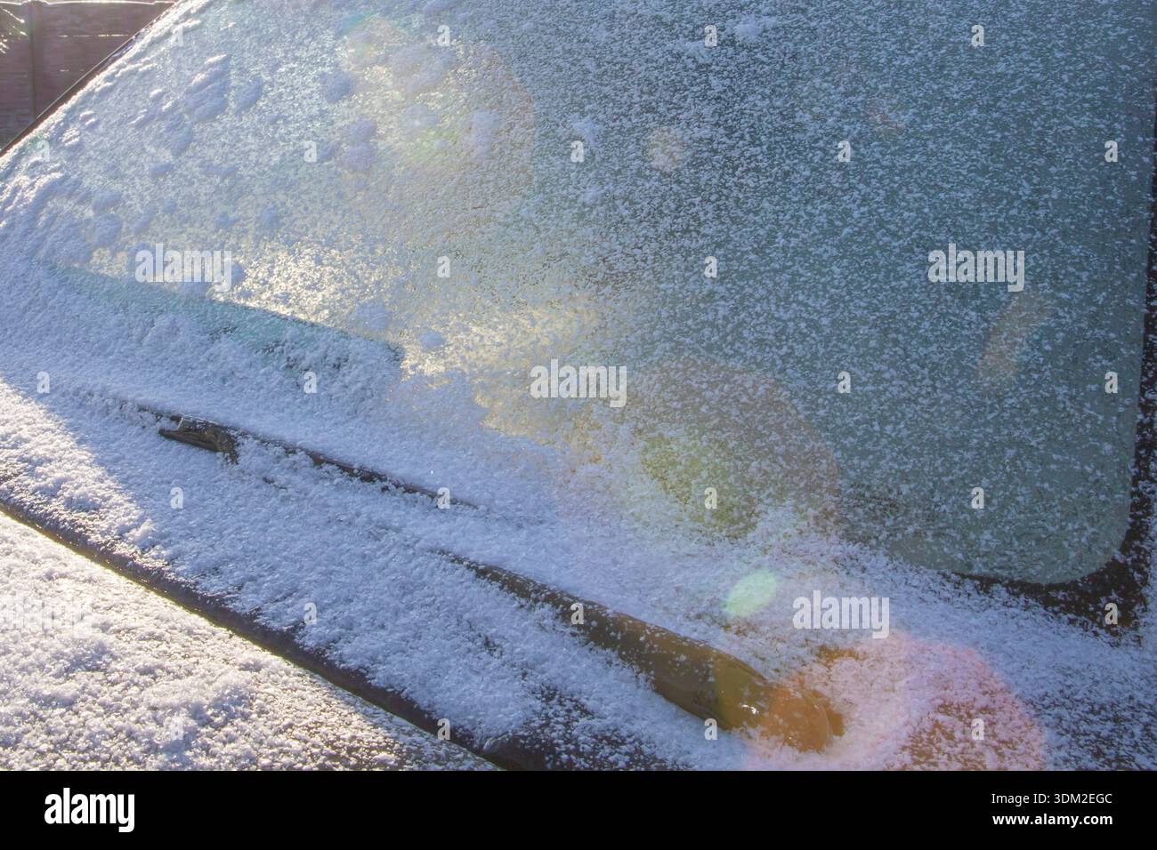 Car windshield covered with snow and frost on cold winter morning Stock ...