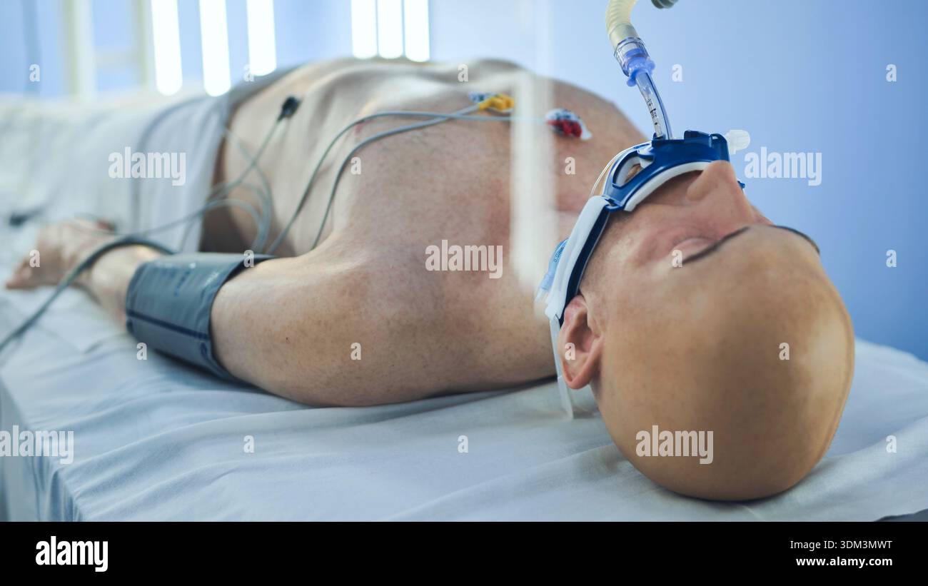 Intubated patient in intensive care unit receiving life support ...