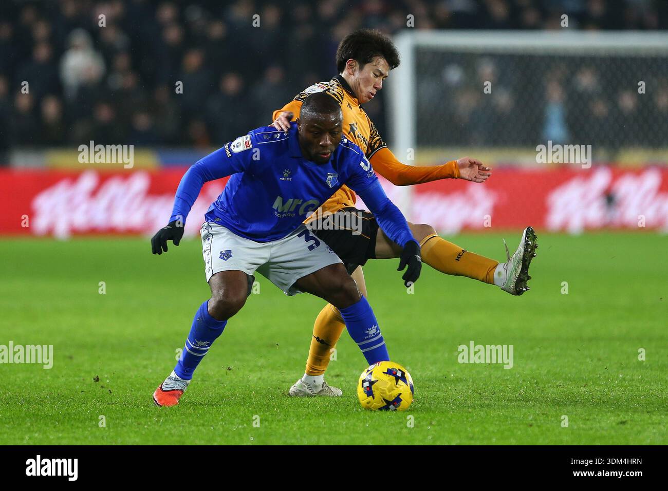 Edo Kayembe of Watford (L) and Yu Hirakawa of Hull City (R) in action ...