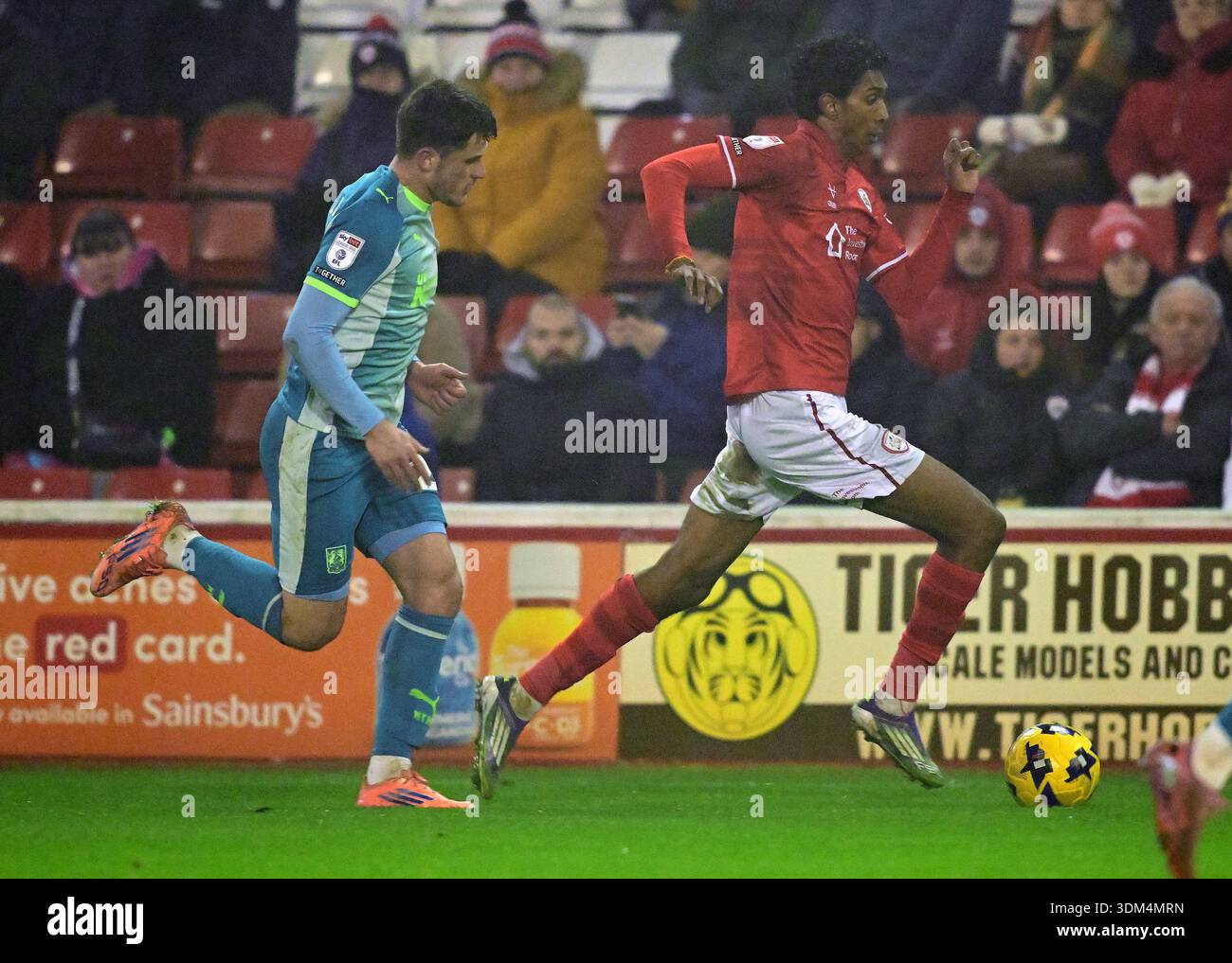 Barnsley's Vimal Yoganathan dribbles with the ball in the match between ...