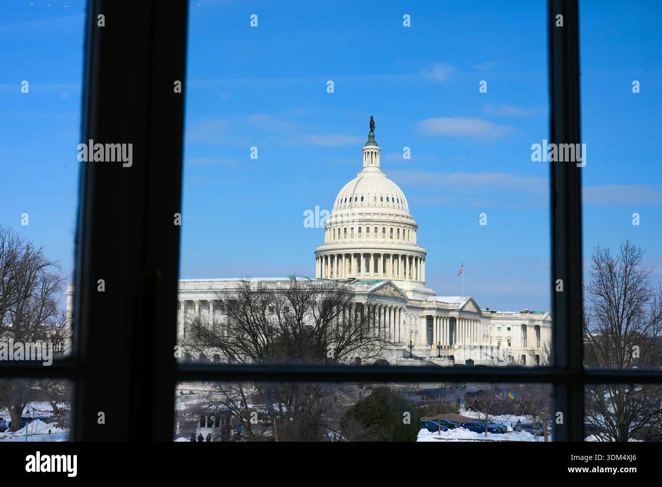 The US Capitol is visible through the Cannon House Office Building ...
