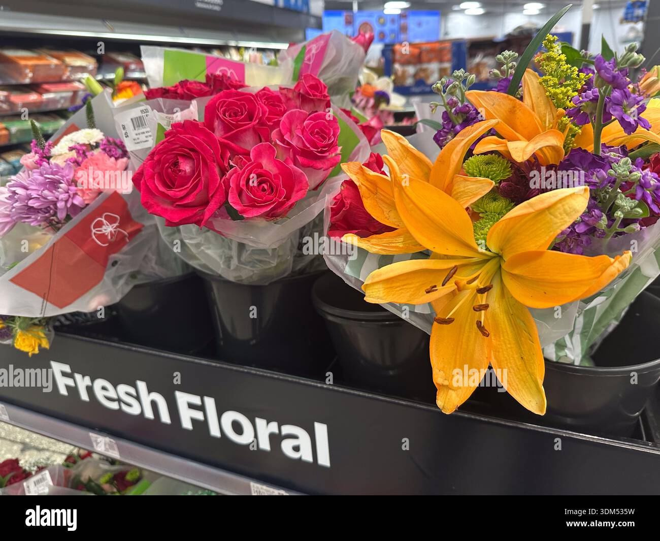 Fresh flower bouquets are displayed for sale at a Walmart store in ...