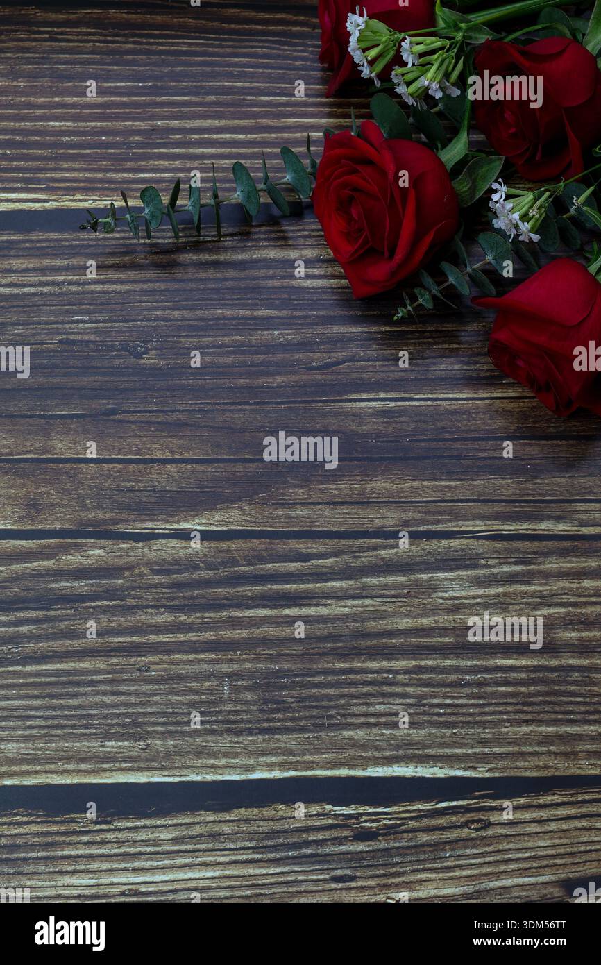 Red roses bouquet on rustic wooden background with copy space Stock ...