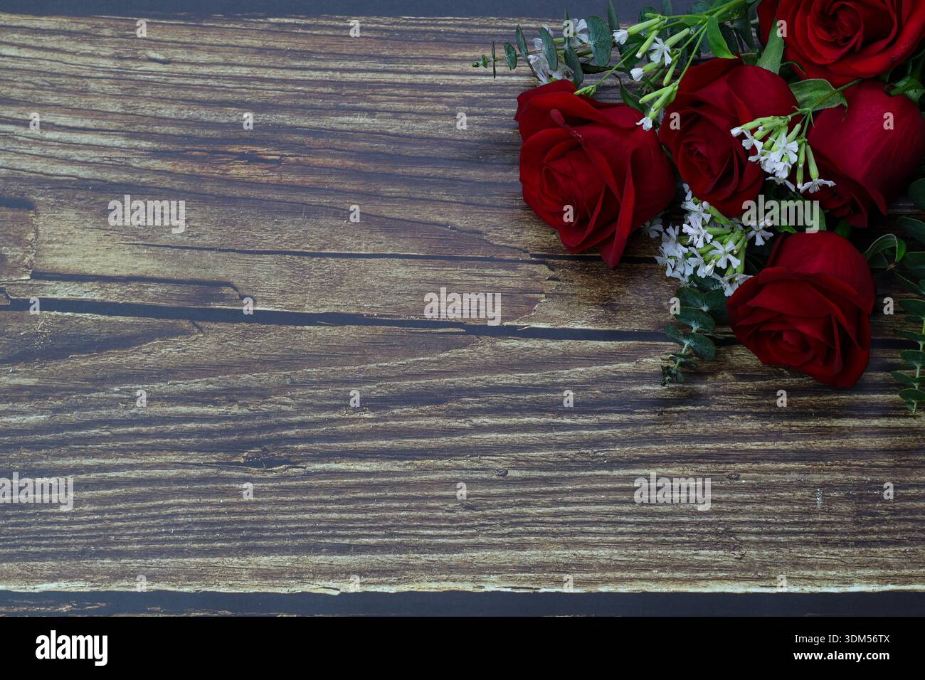 Red roses bouquet on rustic wooden background with copy space Stock ...