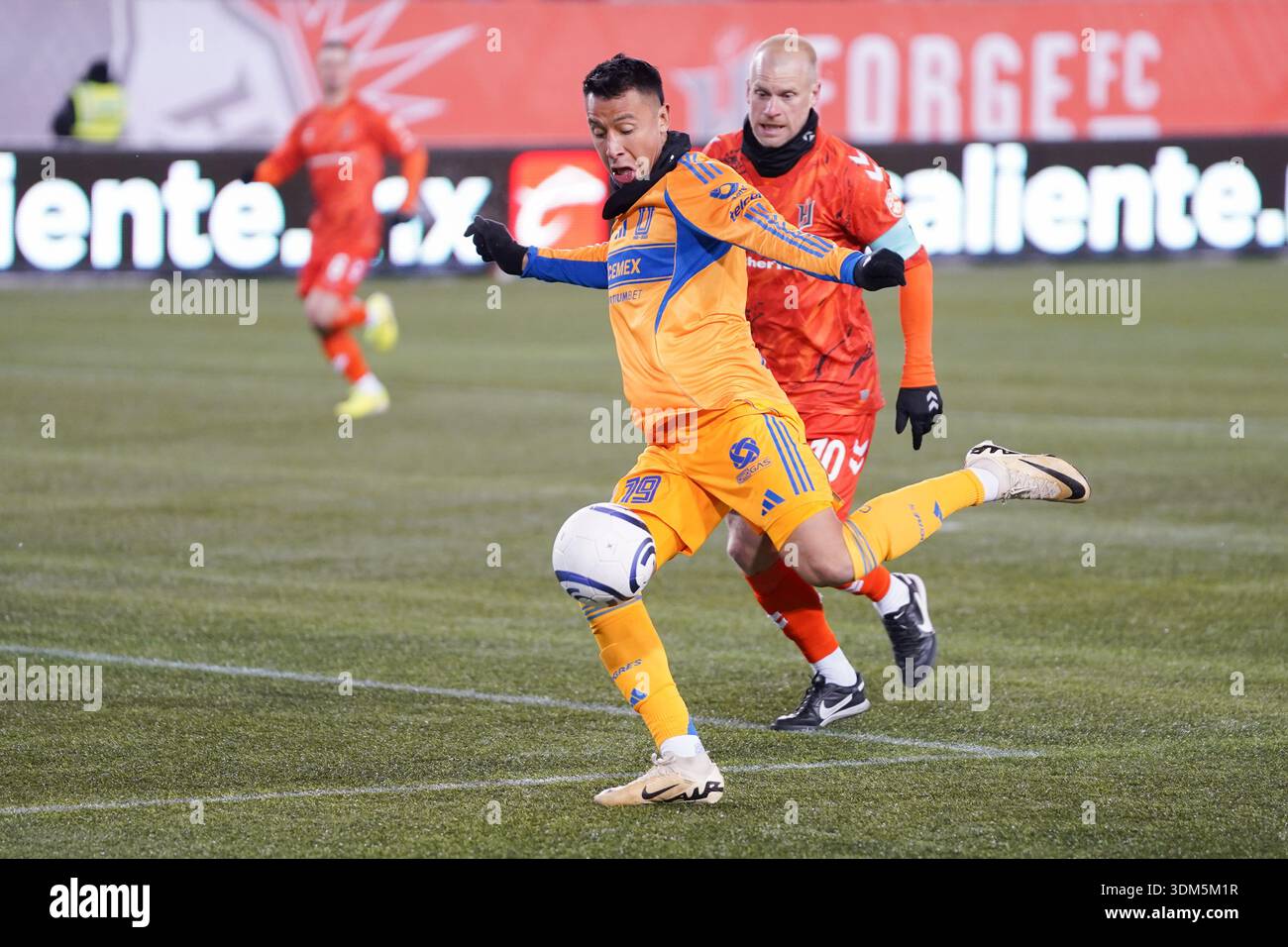 Iván López #19 of Tigres UANL kick the ball during the Concacaf ...