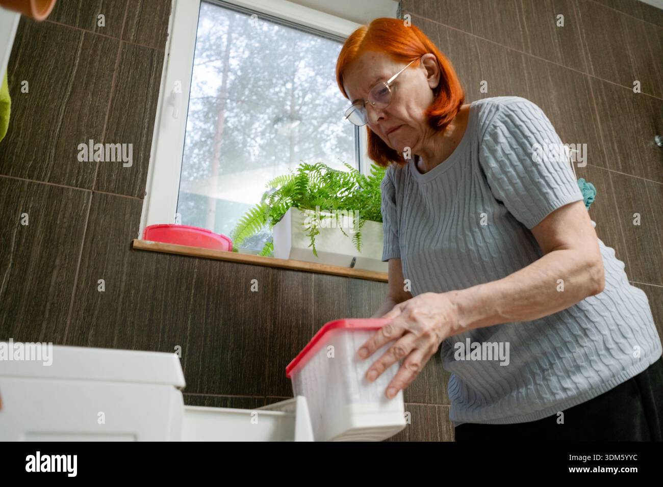 Hand adding detergent drawer hi-res stock photography and images - Alamy