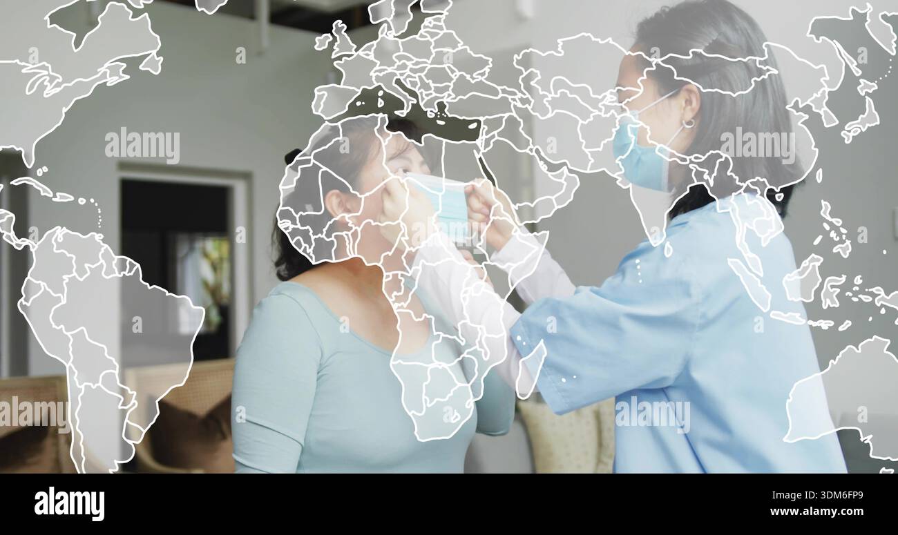 Adjusting caregiver in light-blue scrubs placing mask on seated Korean ...