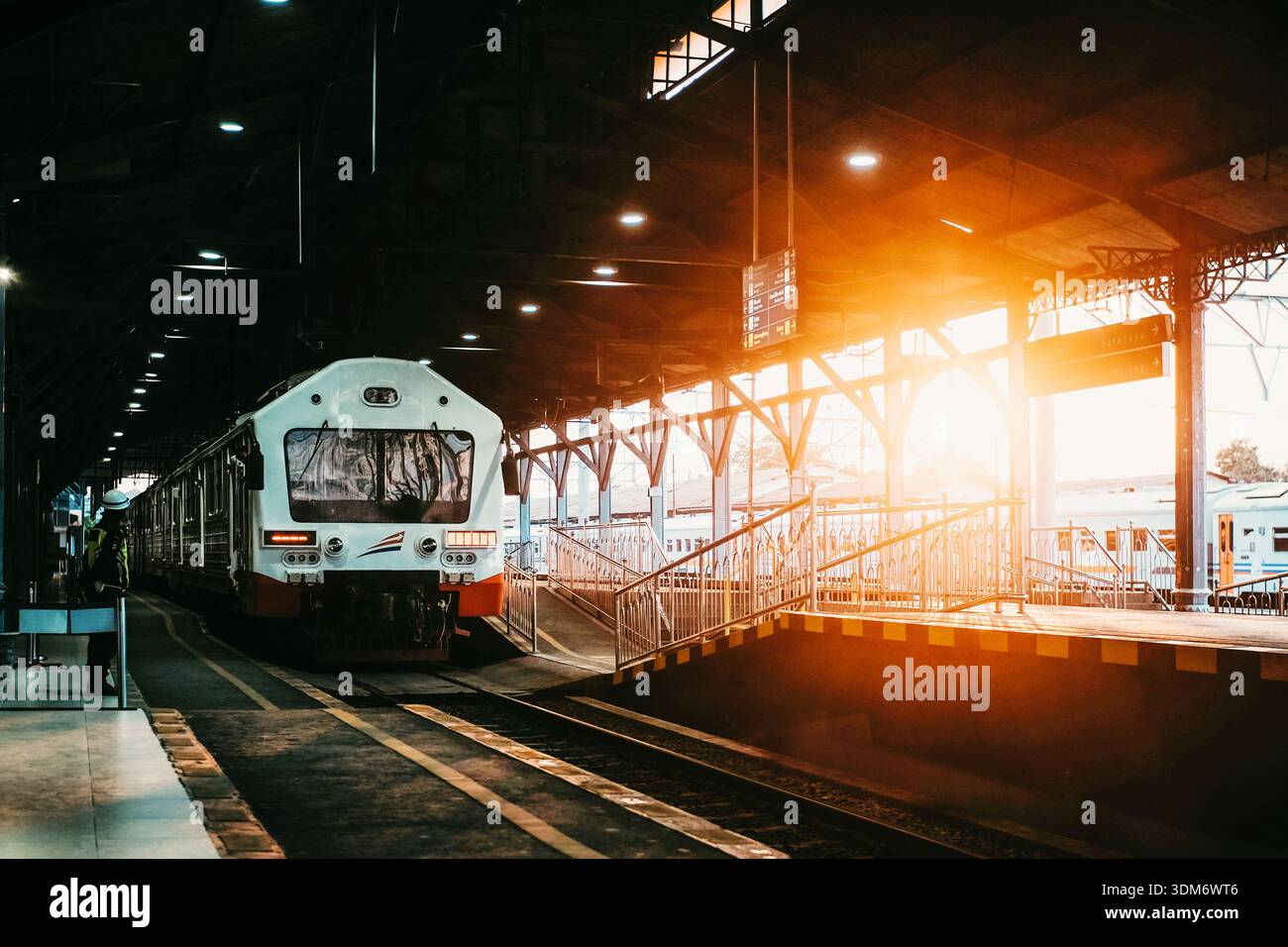 Modern Train Arriving at a Station During Golden Hour Stock Photo - Alamy