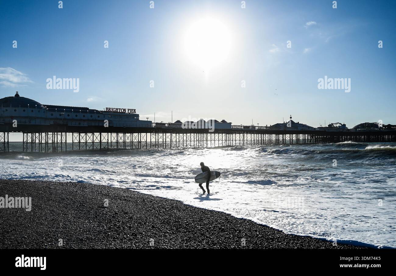 Brighton UK 4th February 2026 - A surfer makes the most of the sunny ...