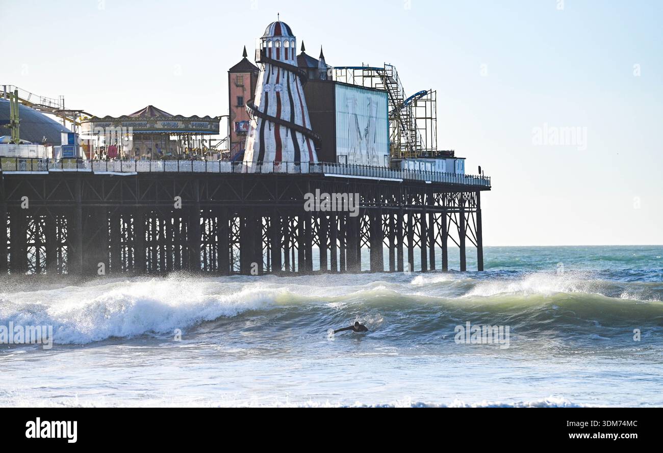 Brighton UK 4th February 2026 - A surfer makes the most of the sunny ...