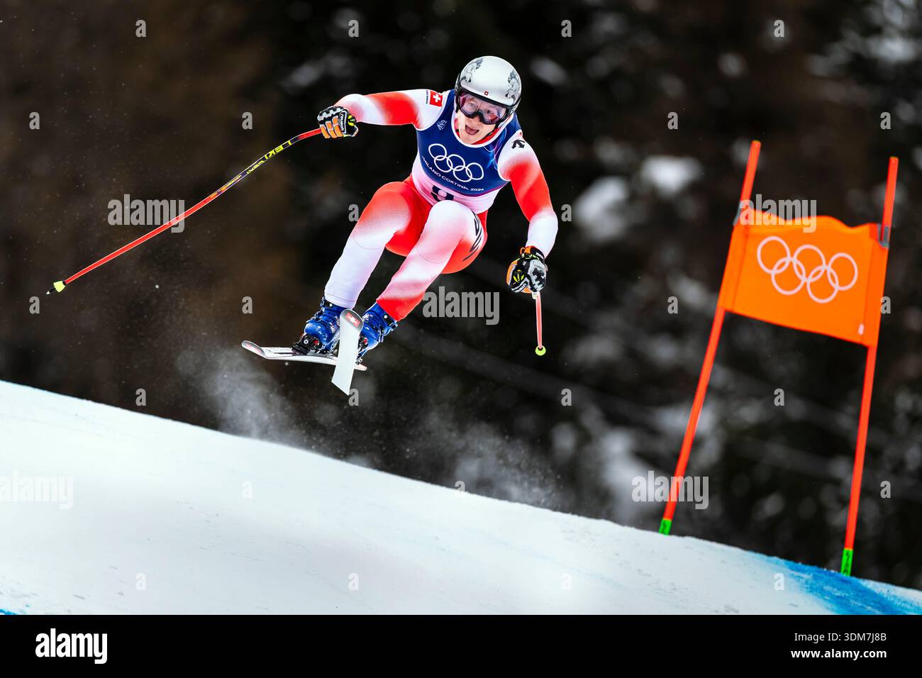 Switzerland's Marco Odermatt takes a jump as he speeds down the course ...