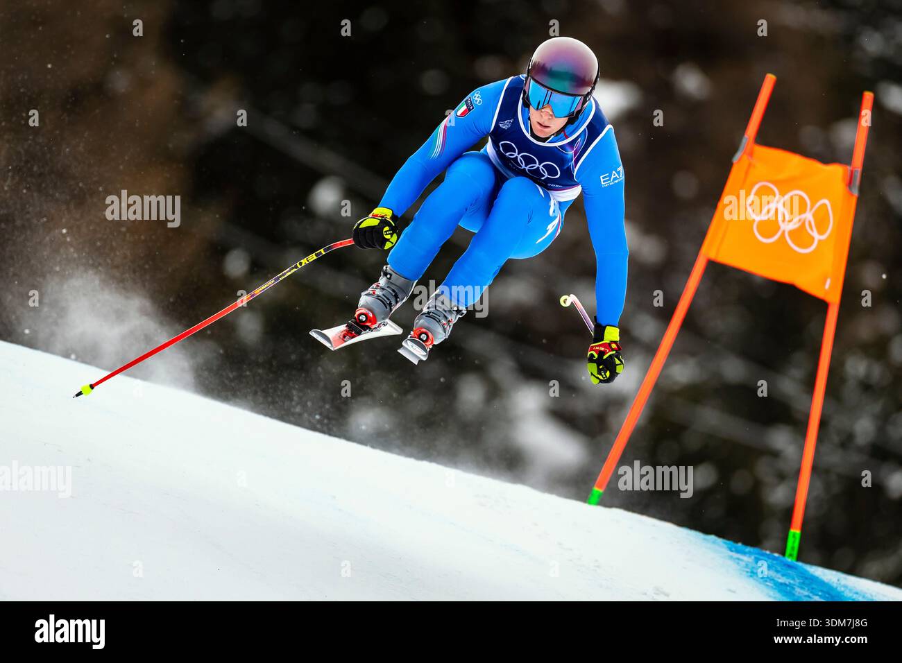 Italy's Giovanni Franzoni takes a jump as he speeds down the course ...