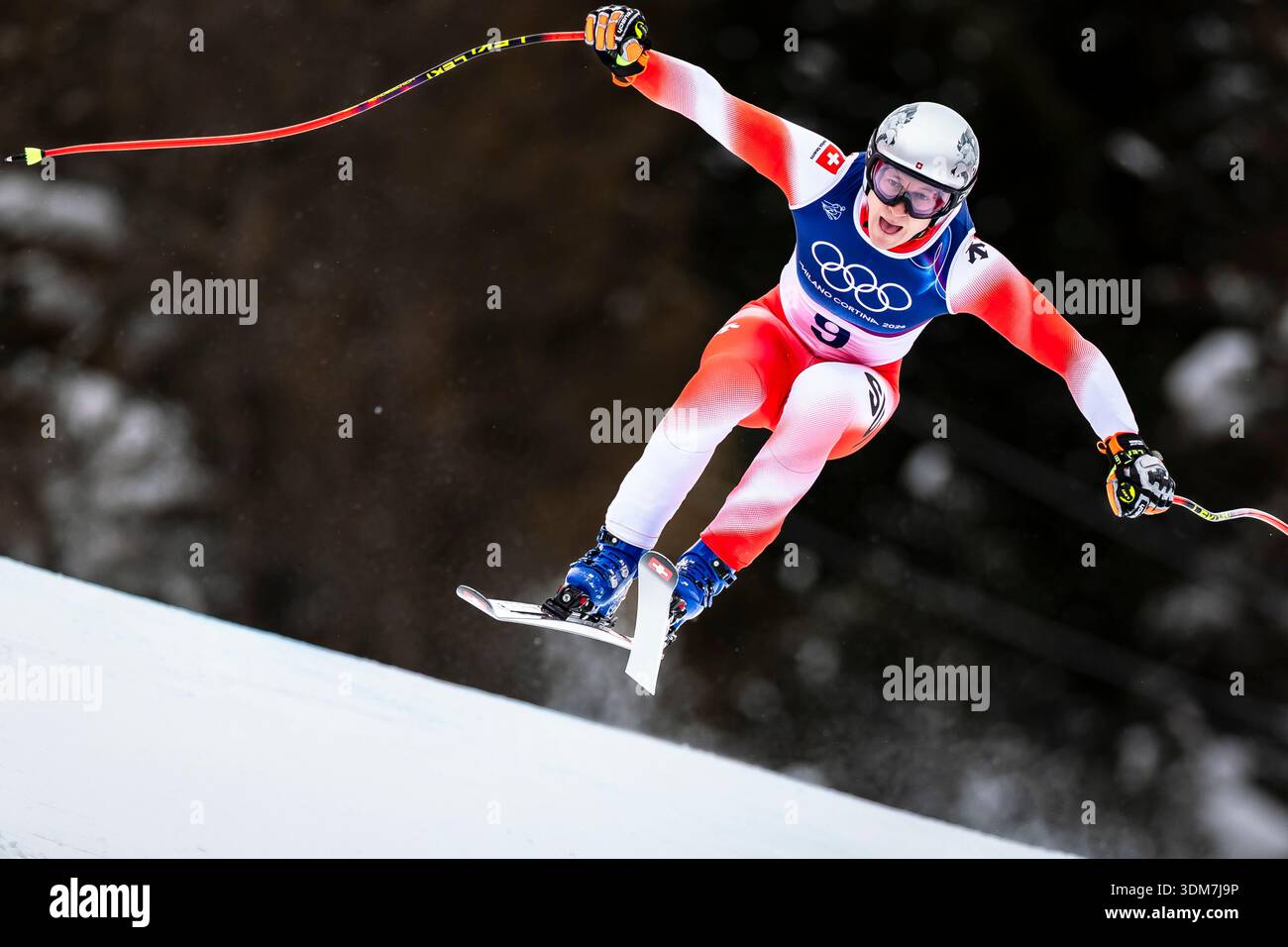 Switzerland's Marco Odermatt takes a jump as he speeds down the course ...