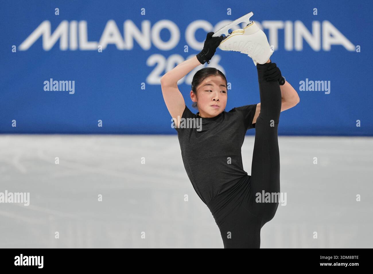 Ruiyang Zhang, of China, performs during a figure skating training ...