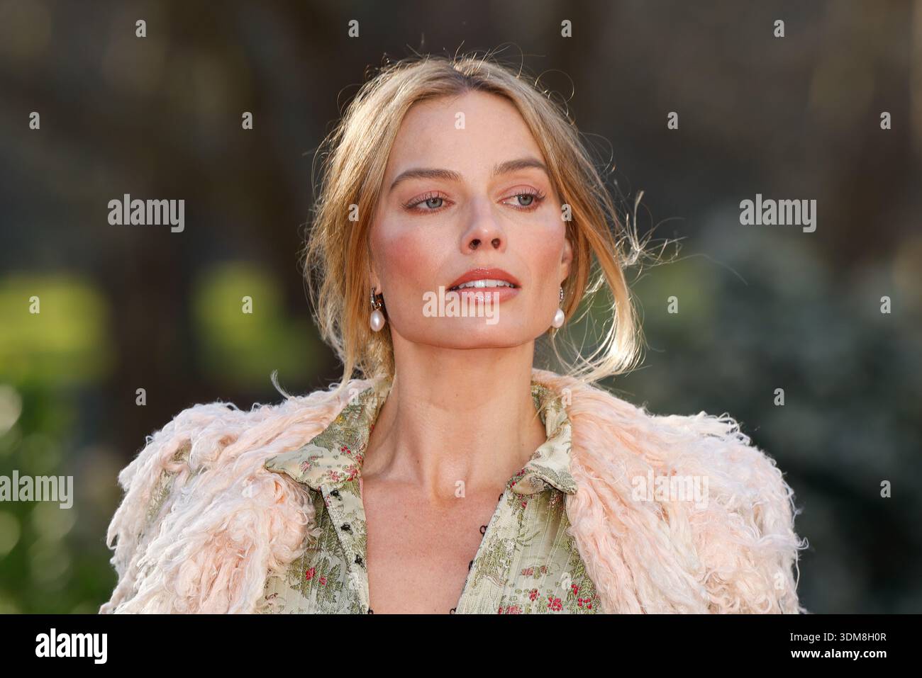 Margot Robbie poses for photographers at the photo call for the film ...