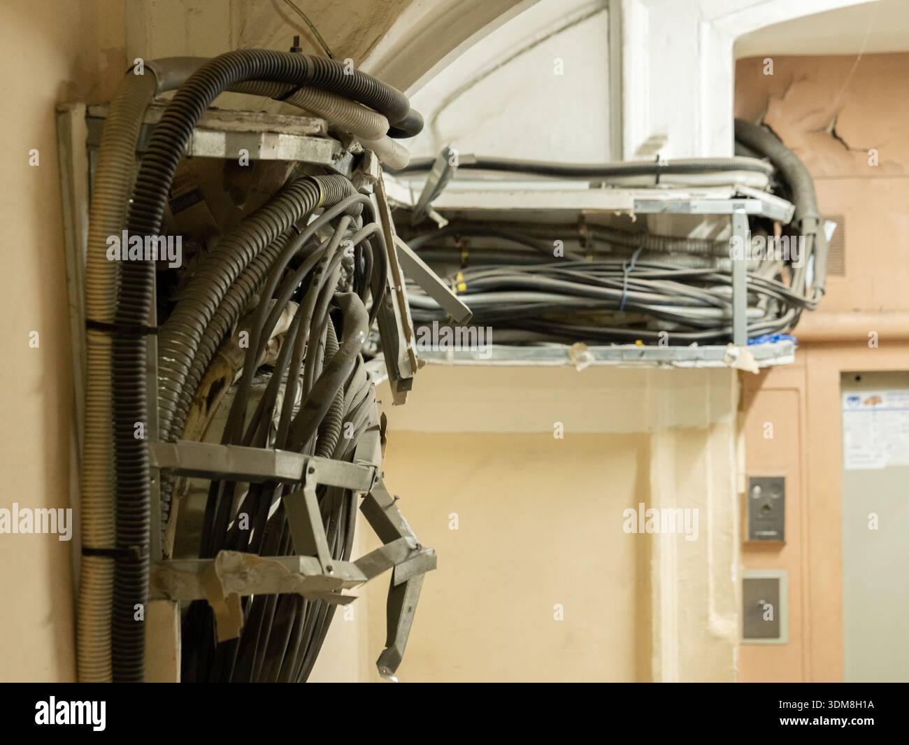 Messy electrical wiring and data cables showing complex infrastructure ...